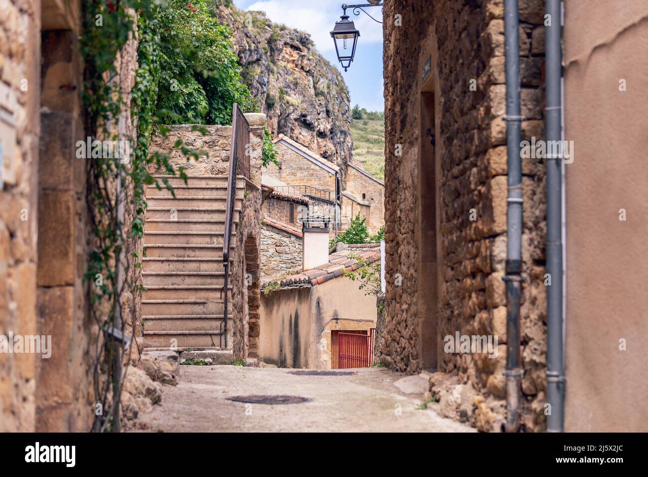 Small tangled streets with medieval buildings, stairs, drain and water ...