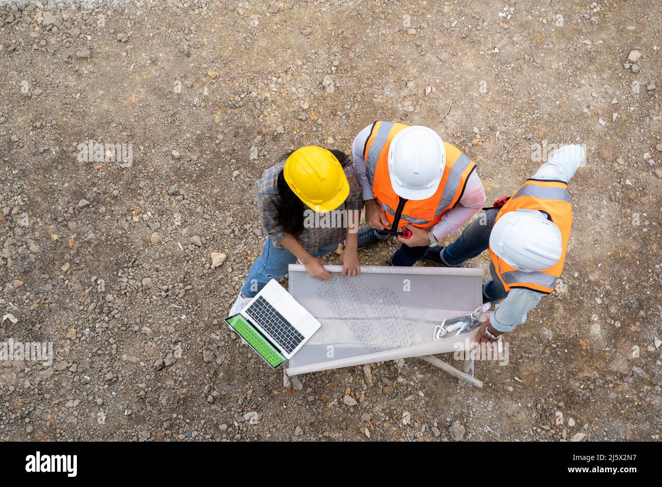 Architect and engineer foreman in helmet working on a building site ...