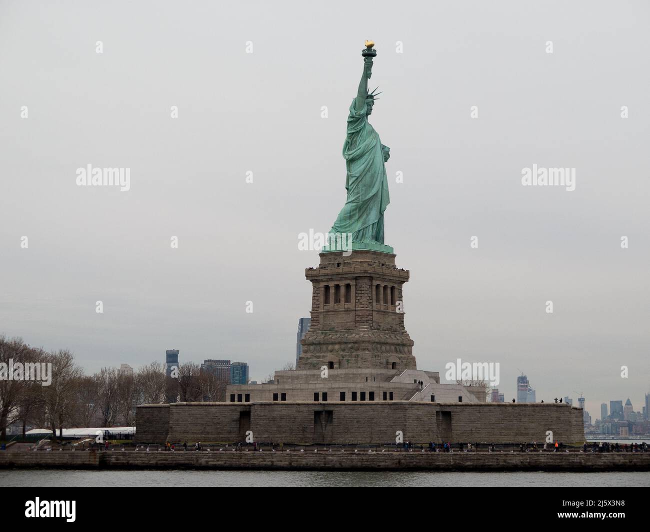 Statue of Liberty on a winters afternoon in December, ellis island, New ...