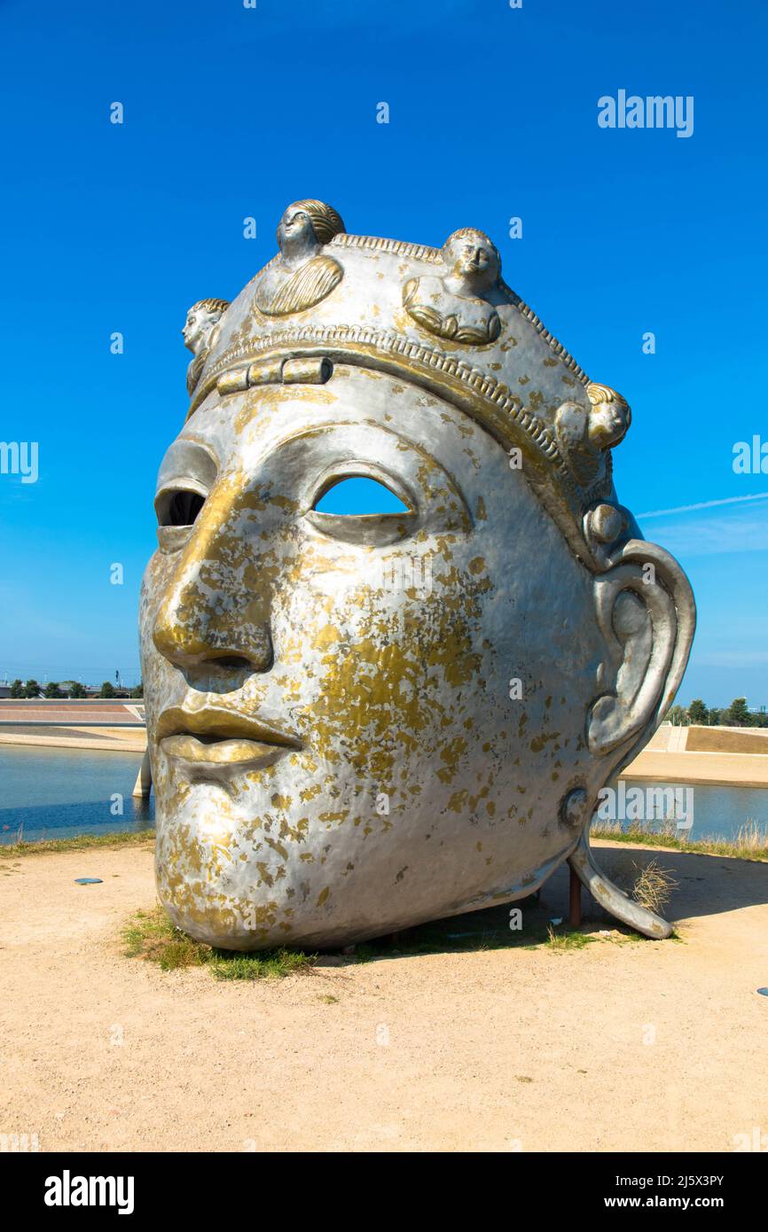 Huge replica of a roman helmet mask on the banks of the Waal river. It ...