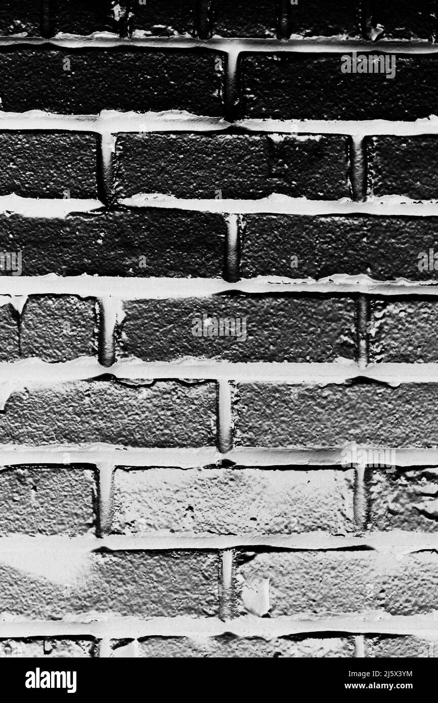 Vintage common brick wall in black and white negative Stock Photo - Alamy