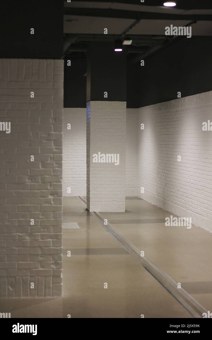 Unusual and interesting interior room with brick columns and a winding ...