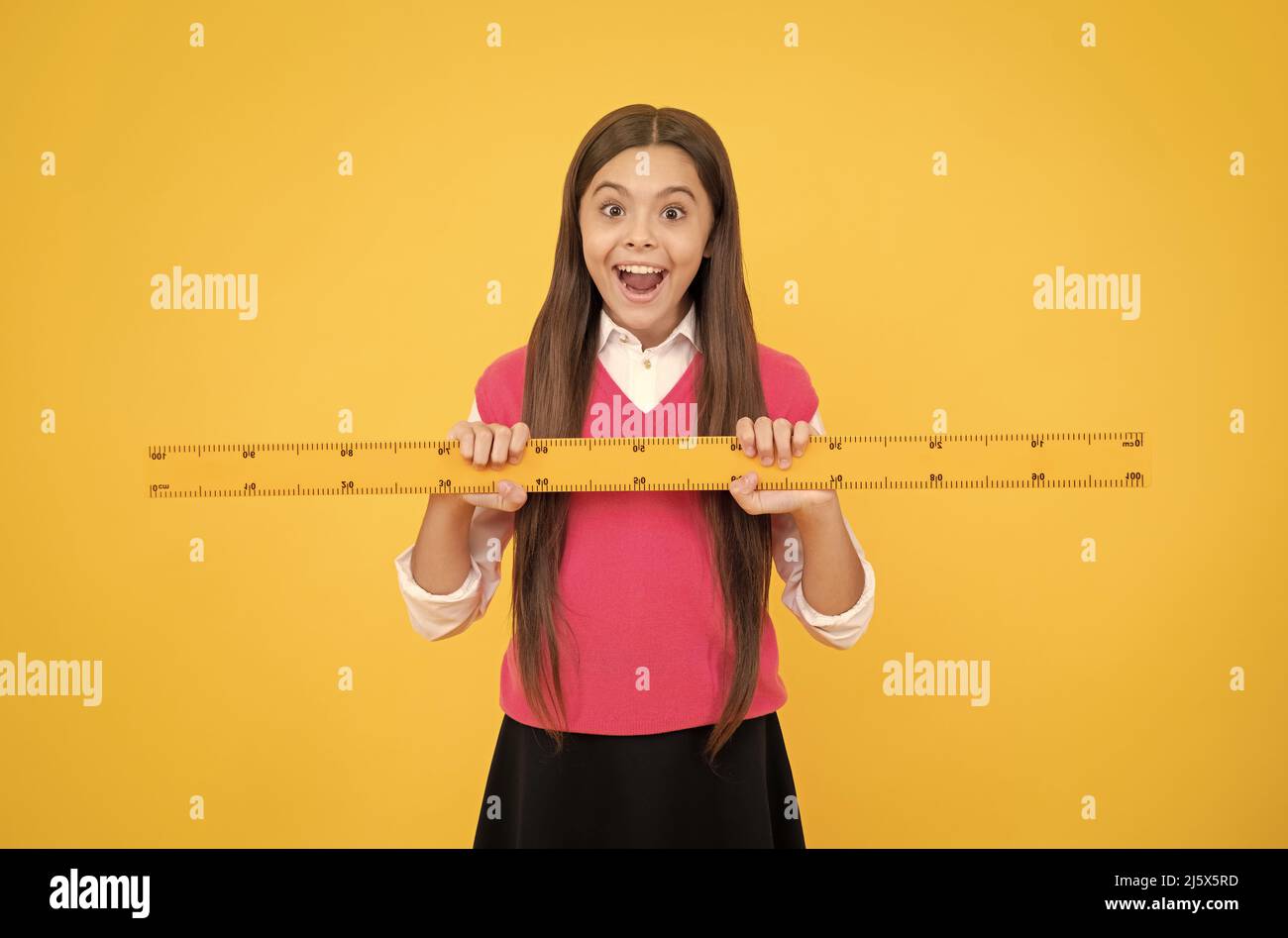 surprised kid girl use ruler to learn mathematics, measurement Stock ...