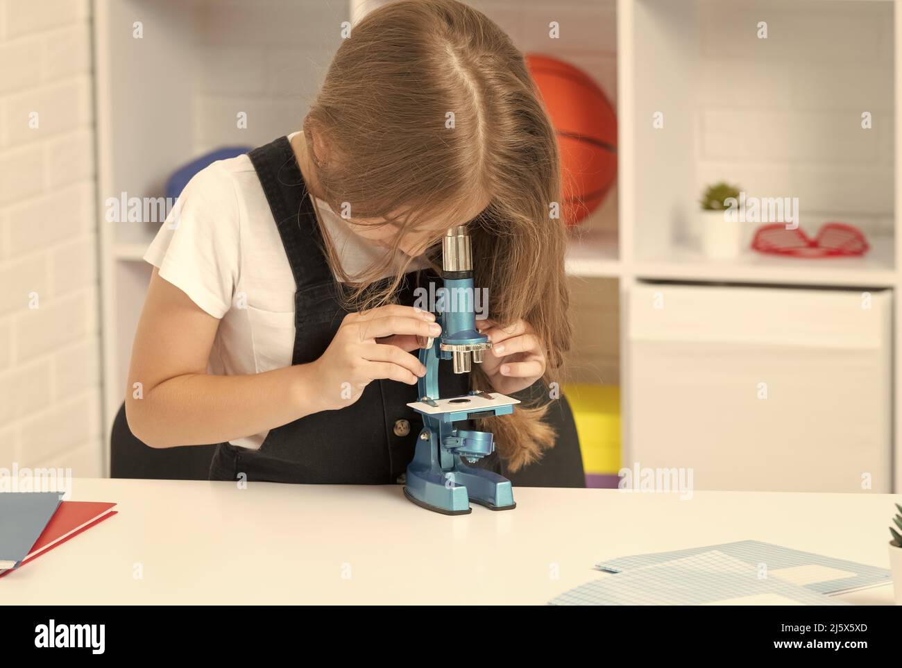future scientist kid looking through scope. harness scientific method ...