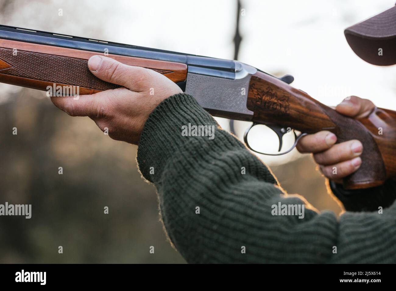 Man aiming rifle during hunting in nature Stock Photo - Alamy