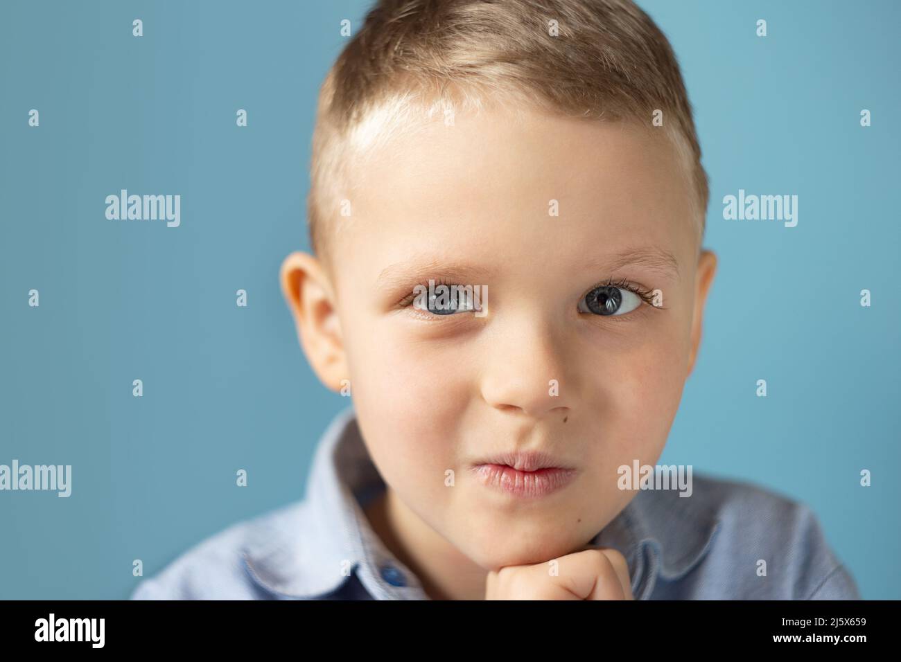 Closeup portrait of cute boy with blue eyes Stock Photo - Alamy