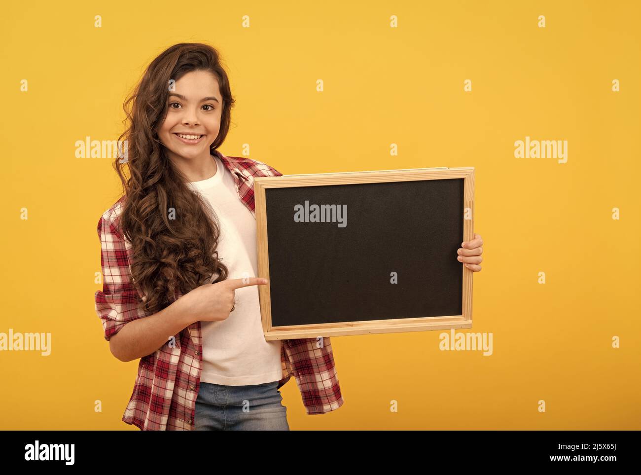 Happy kid pointing space hi-res stock photography and images - Alamy