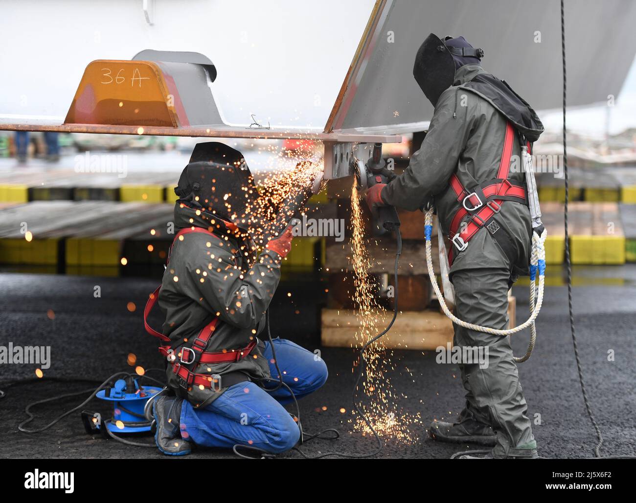 Merkenich, Germany. 26th Apr, 2022. Welders work on a steel bridge ...
