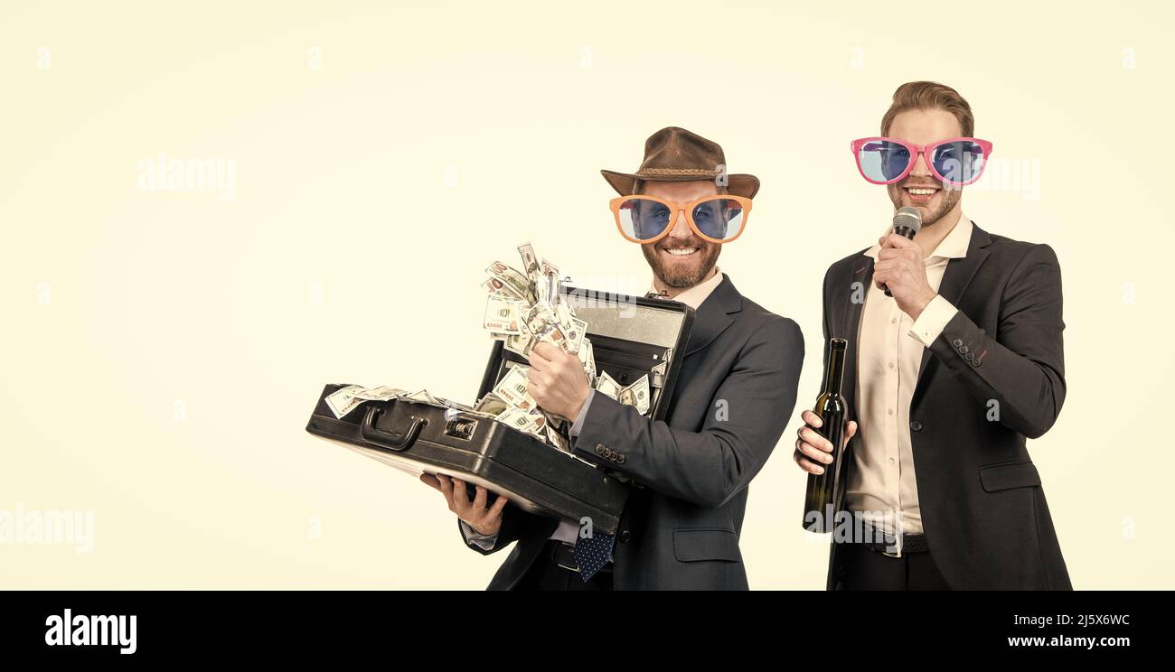 Happy showman and winning man holding money suitcase celebrate win ...