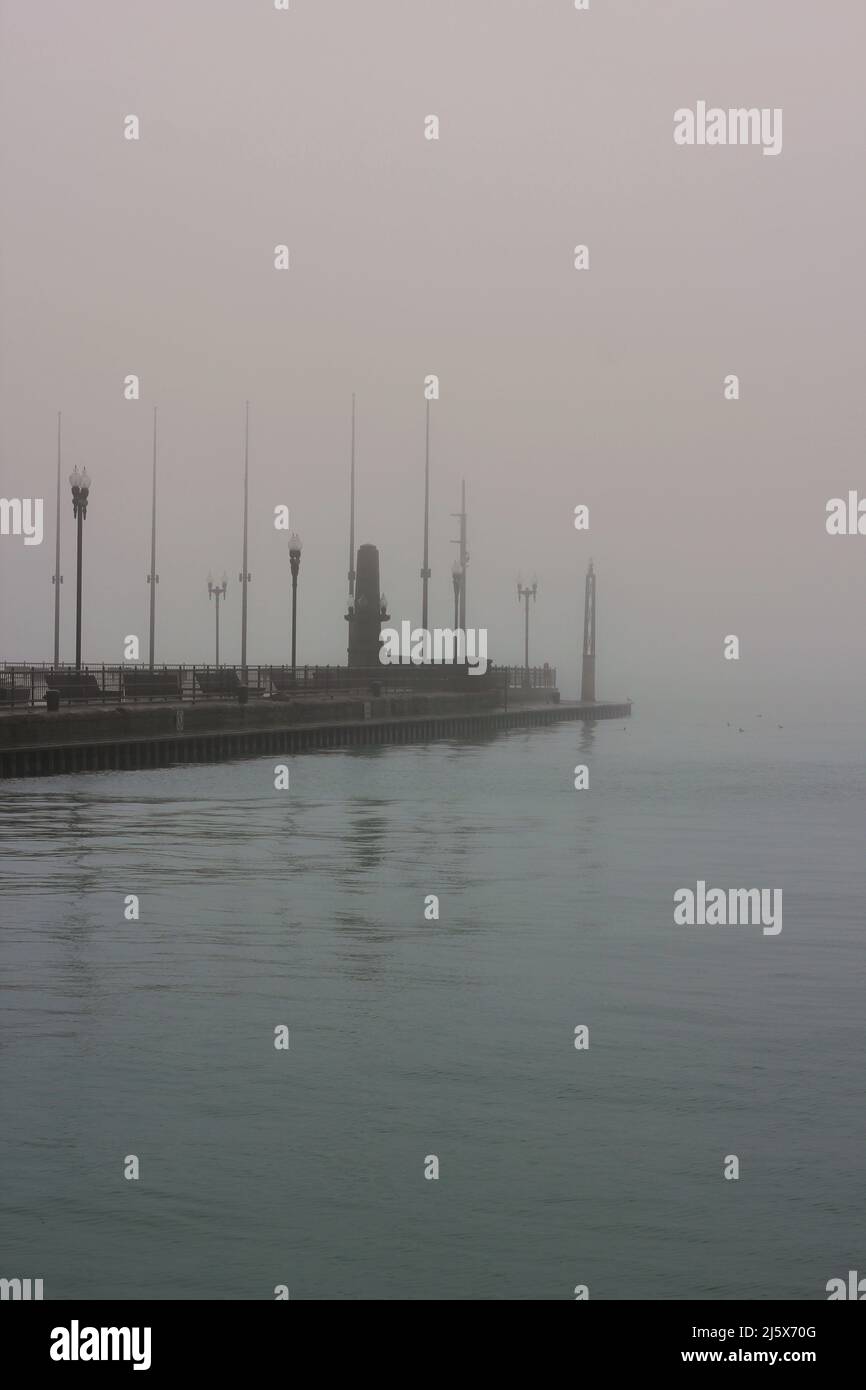 Waterfront pier in very heavy fog on the shoreline Stock Photo - Alamy