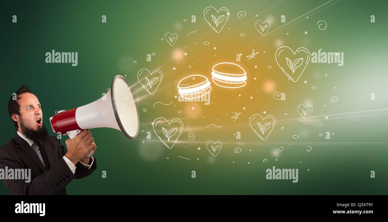 Young person with megaphone and healthy food icon Stock Photo - Alamy
