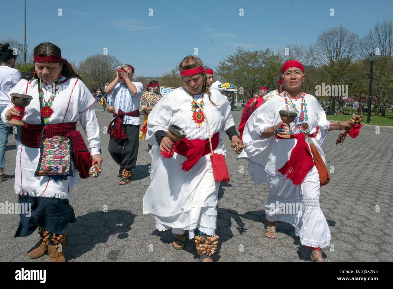 The Calpulli Mexican Dance Group march near the Unisphere in a ...