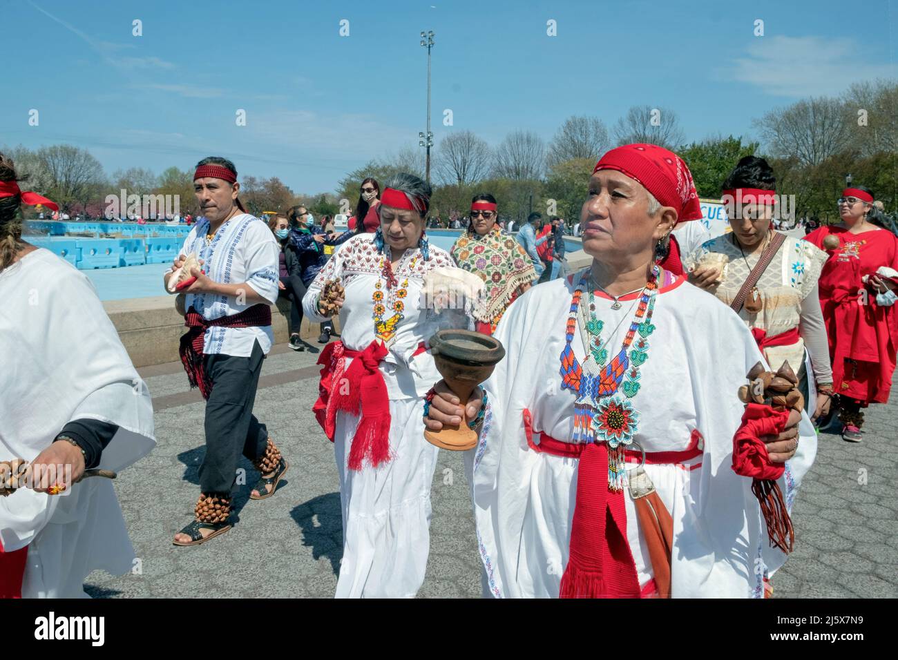 The Calpulli Mexican Dance Group march near the Unisphere in a ...