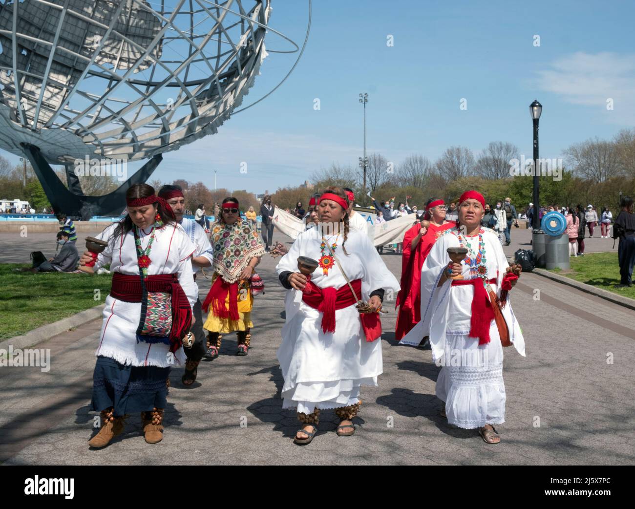 Performers from the Calpulli Mexican Dance Group march, dance ...