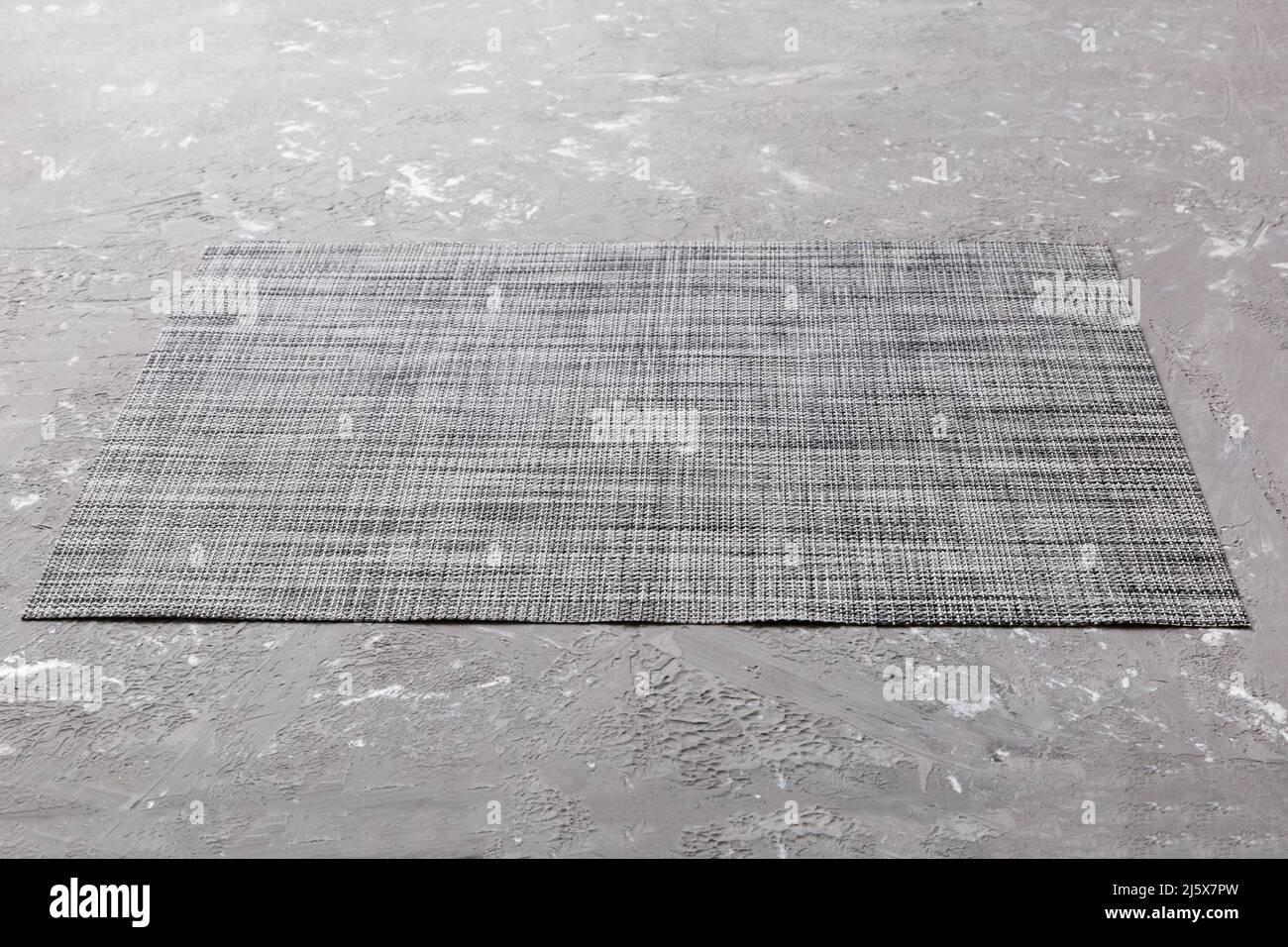 Perspective view of grey tablecloth for food on cement background ...