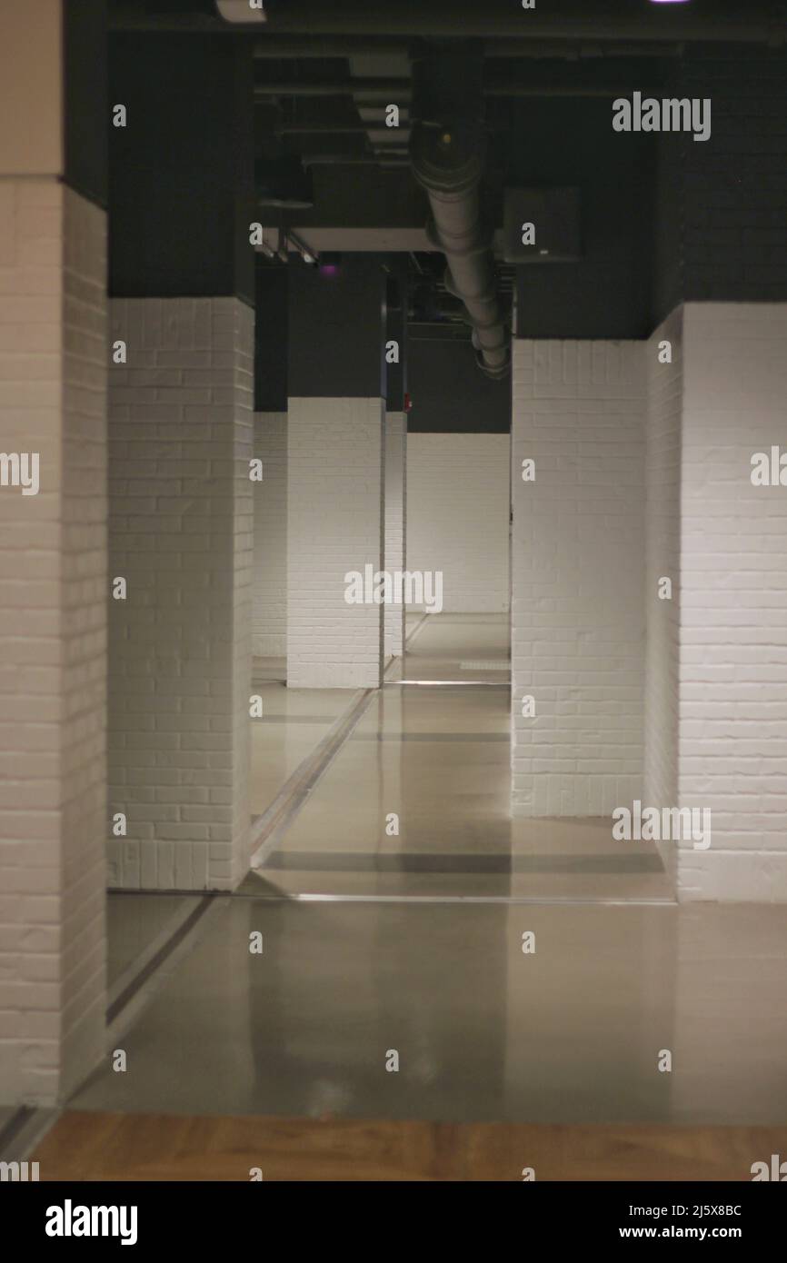 Unusual and interesting interior room with brick columns and a winding ...