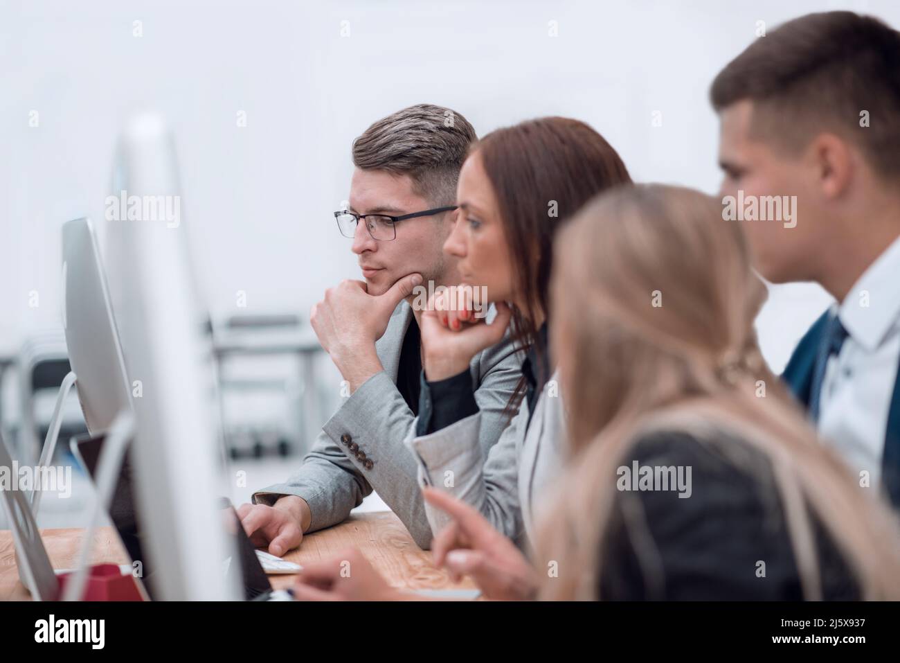 group of employees work with incoming information Stock Photo - Alamy
