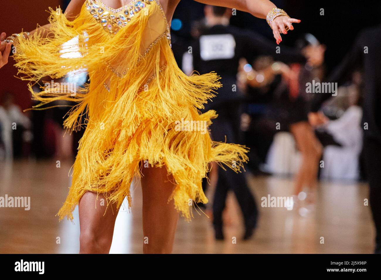 female dancer in yellow dress in dance competition Stock Photo - Alamy