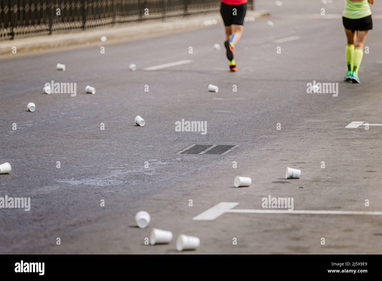 point of water marathon race. used plastic cups on asphalt Stock Photo ...