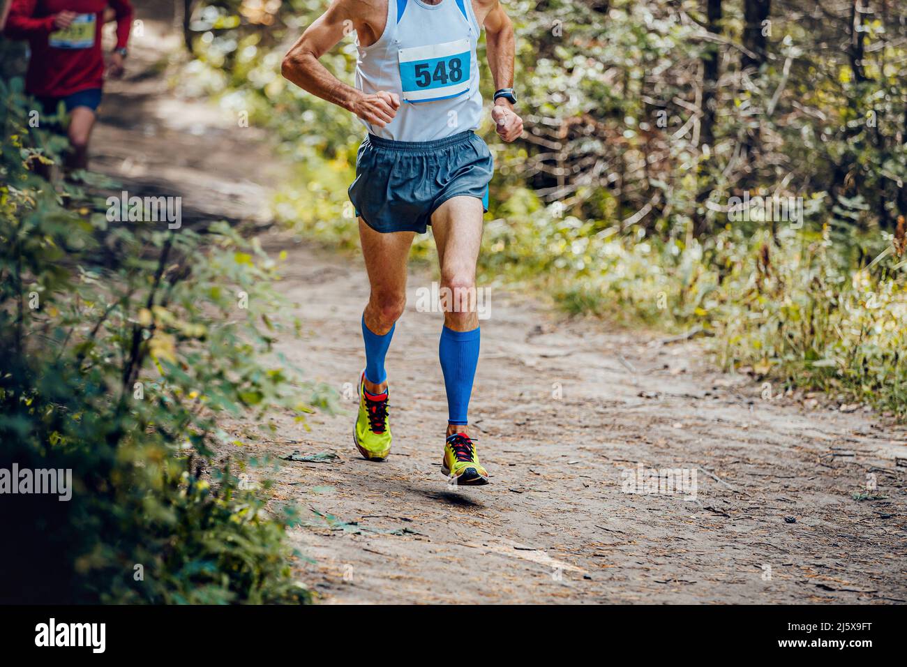 male athlete runner run forest trail marathon Stock Photo - Alamy