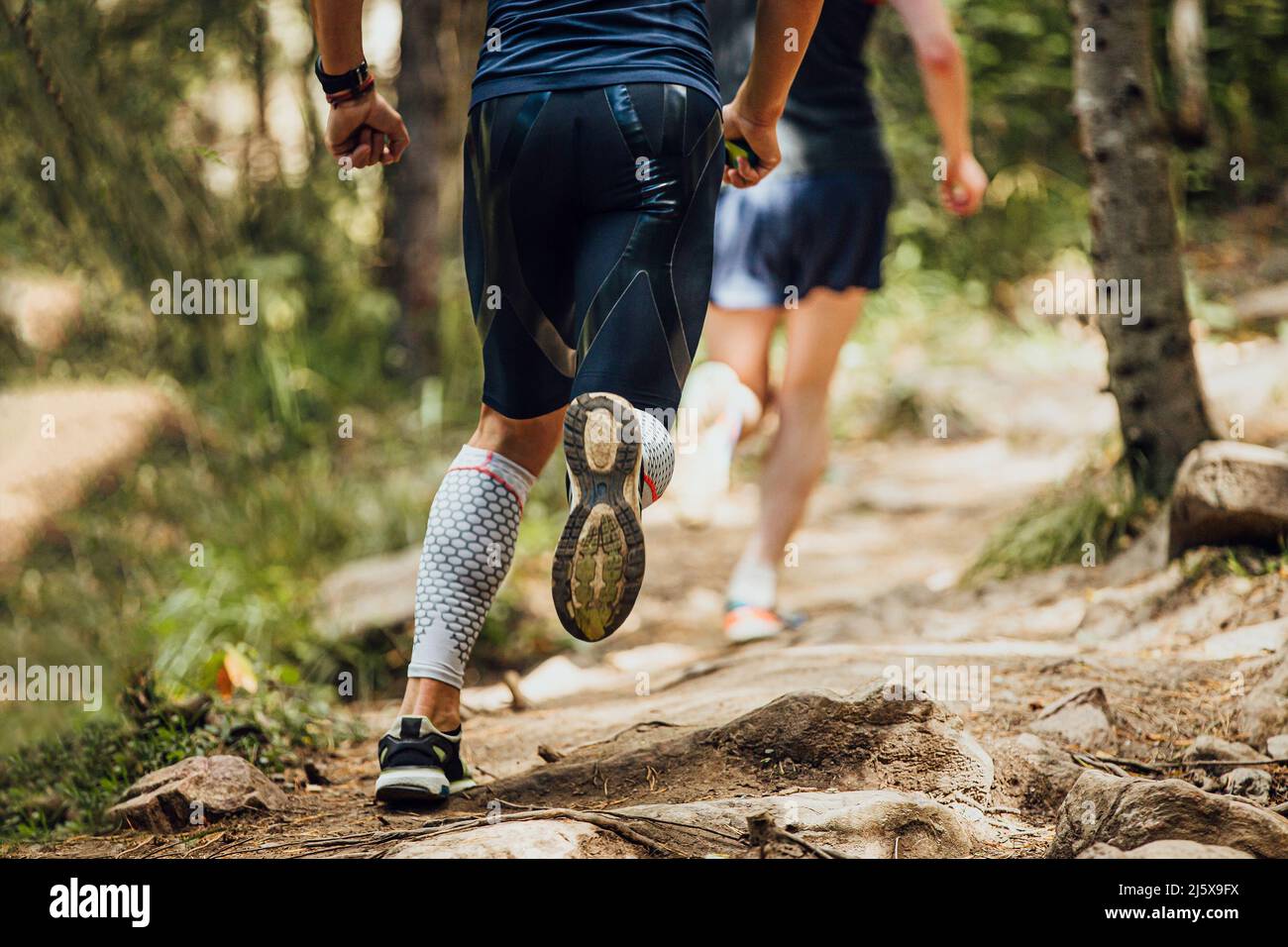 back man runner athlete run forest trail Stock Photo - Alamy