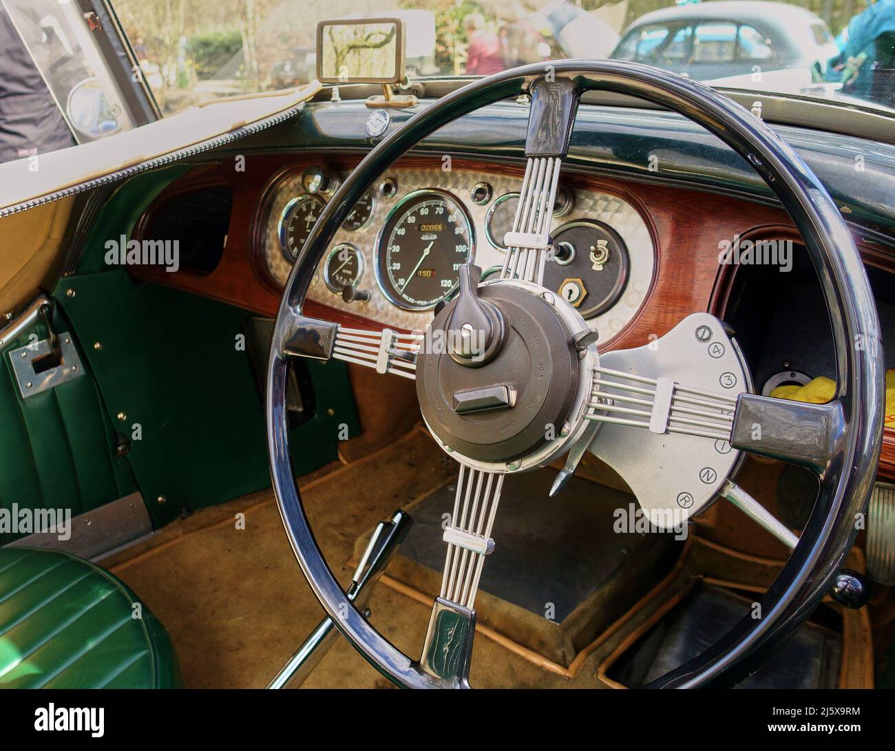 Image showing the very large steering wheel and dashboard of a pre war ...