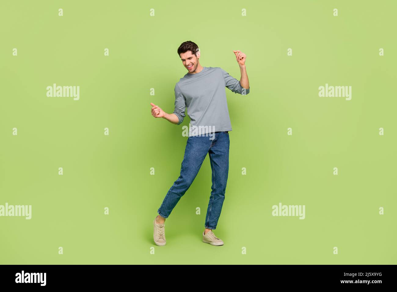 Full length image of cheerful male have fun dancing spend summer ...