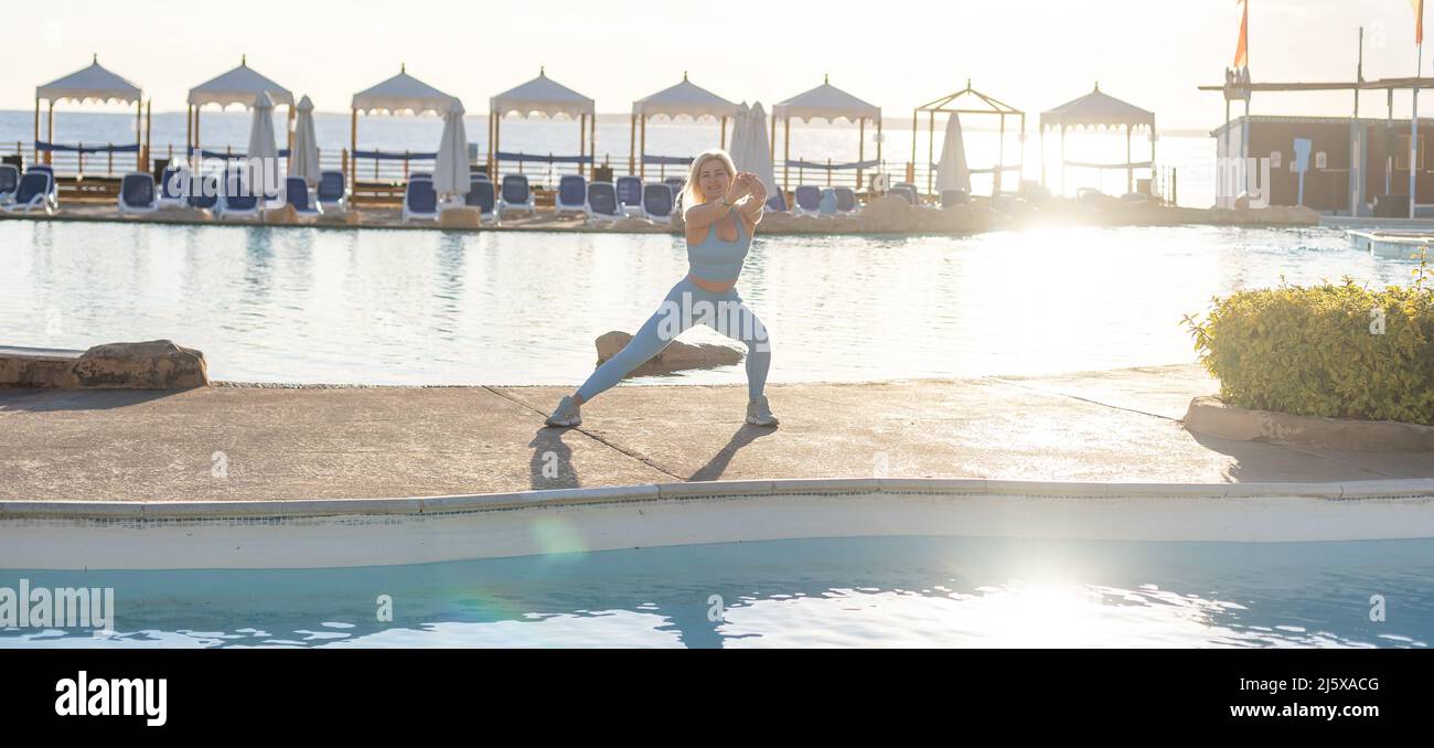 Good morning with yoga meditating on sunrise background. Active woman ...