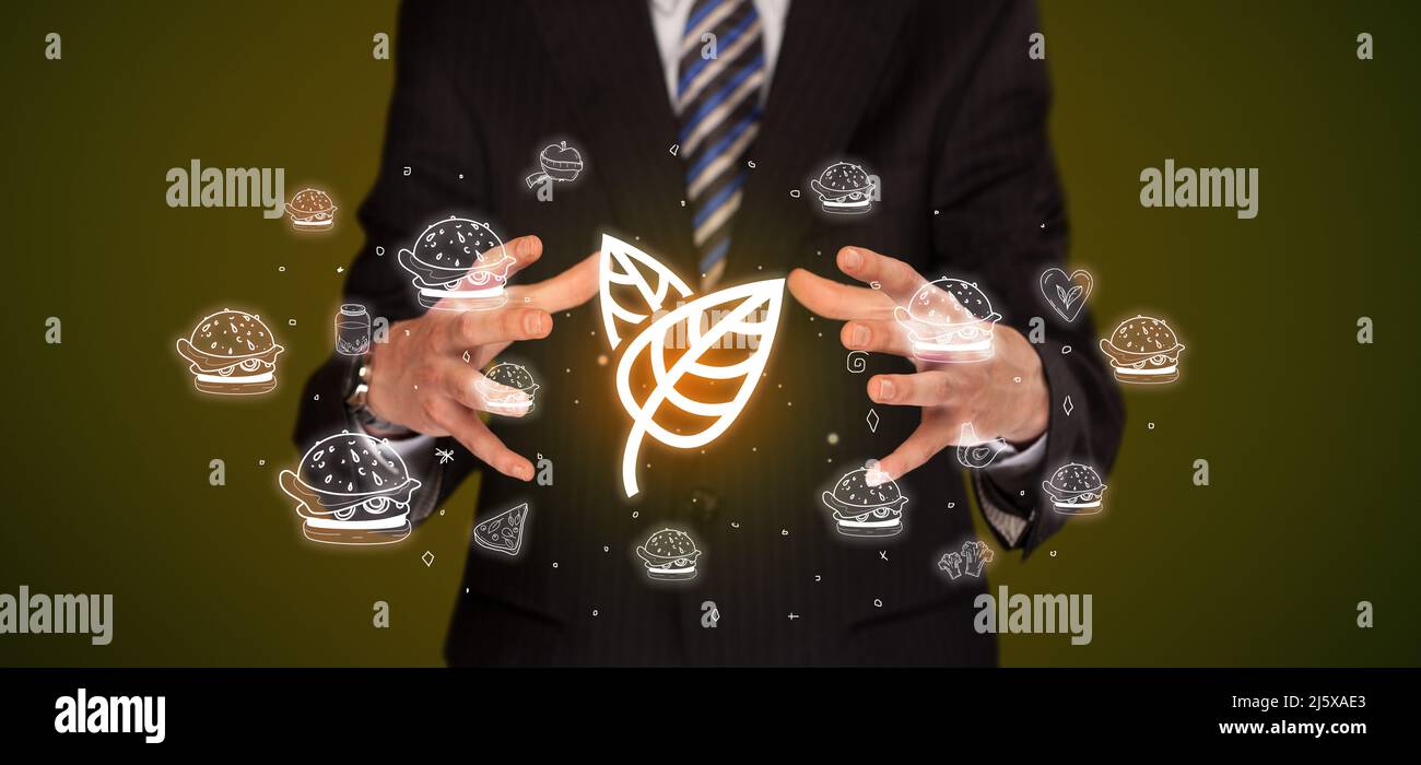 Hand holding food related icons Stock Photo - Alamy