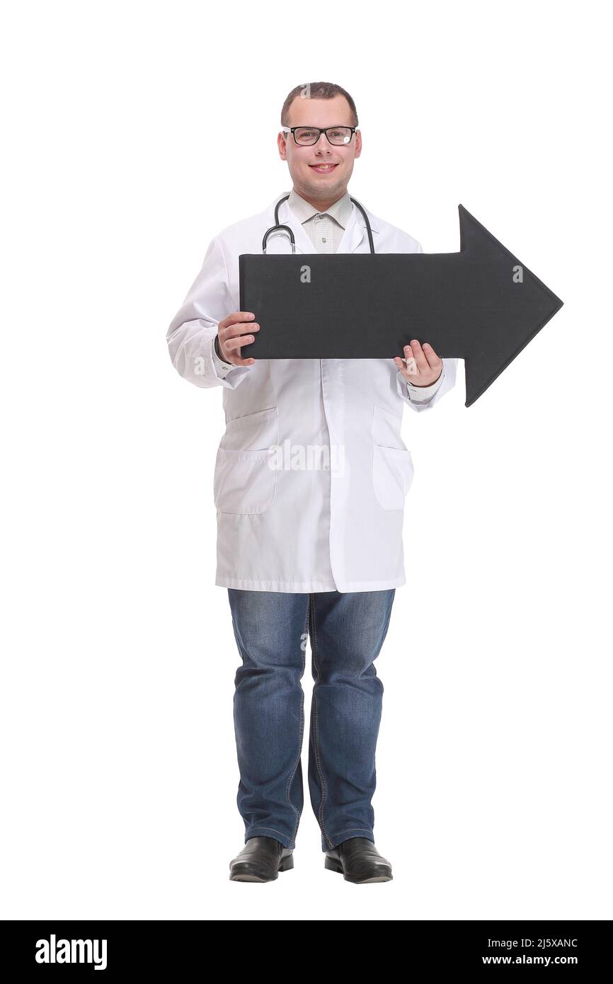 Front view of young smiling doctor holding a black arrow pointing right ...