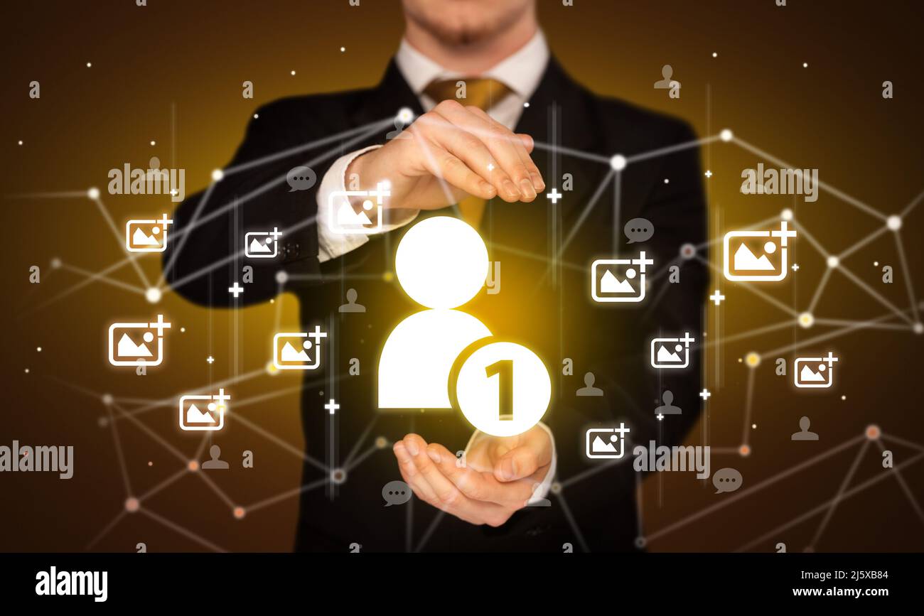 Hand holding social media icons Stock Photo - Alamy