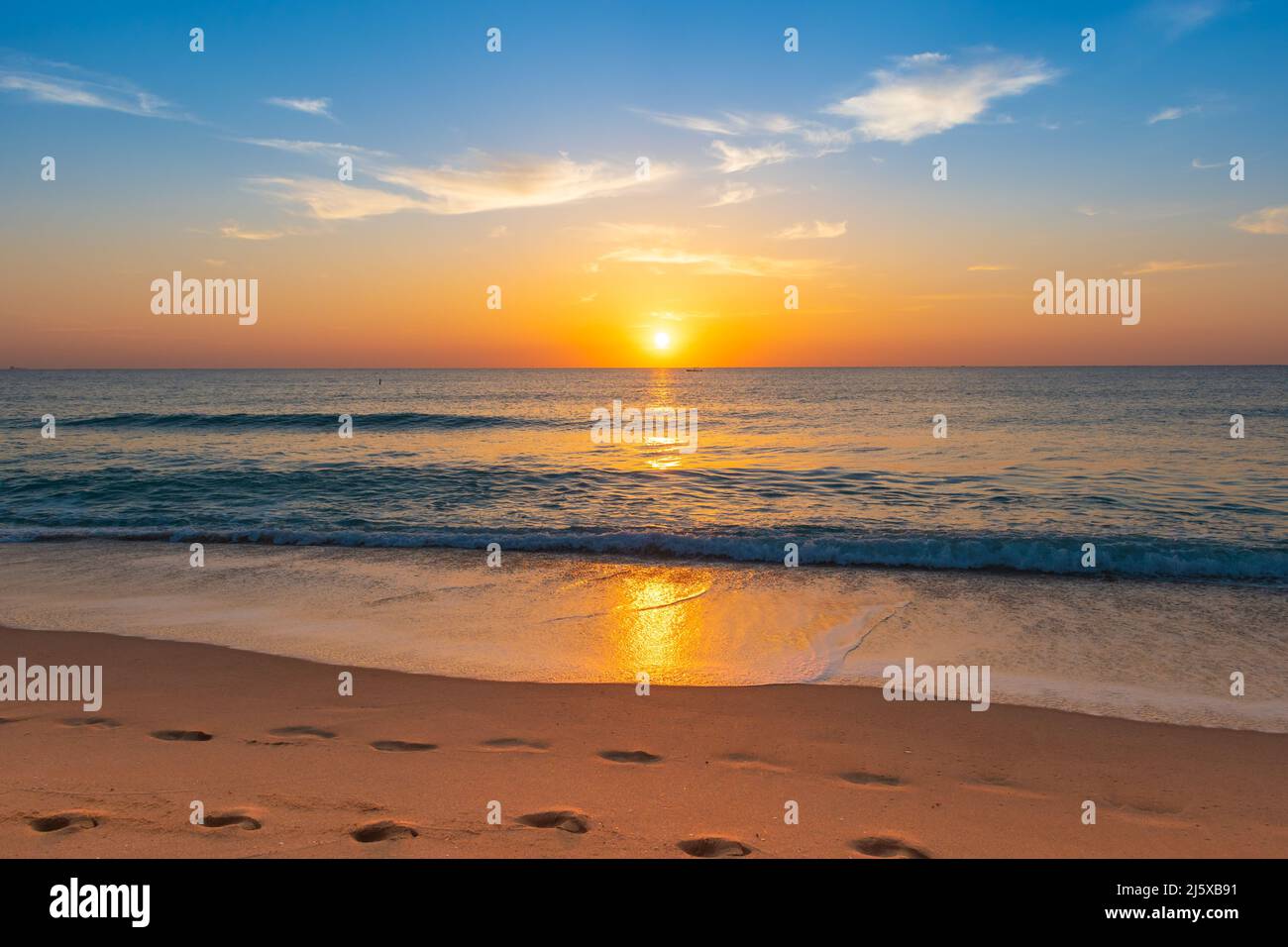 Stunning sunrise and beach landscape Stock Photo - Alamy