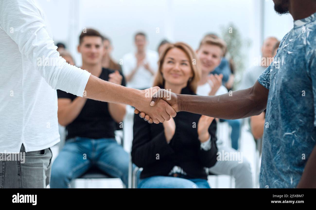 Group shake hands speaker hi-res stock photography and images - Alamy