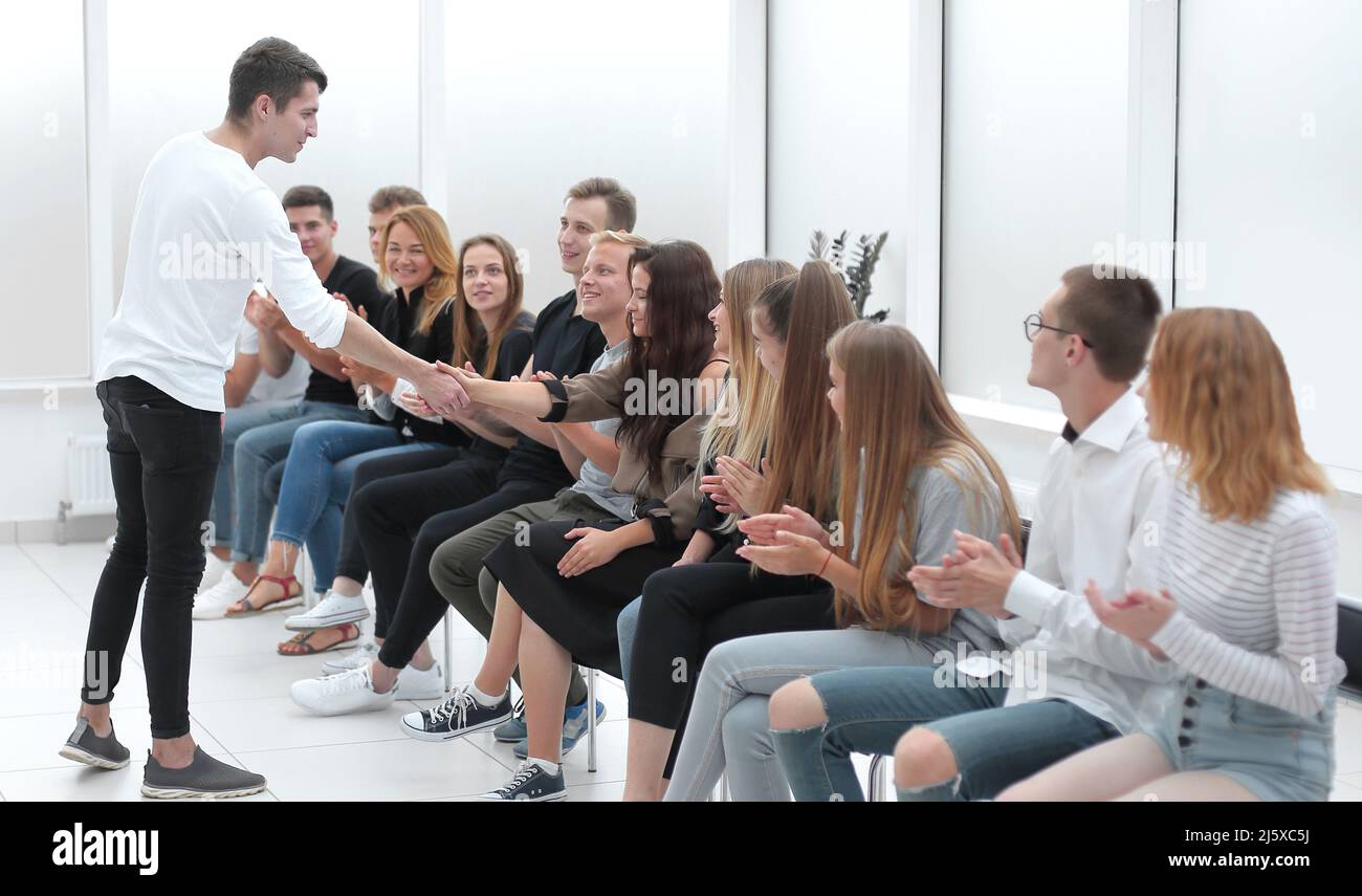 handshake of young people during business training Stock Photo - Alamy