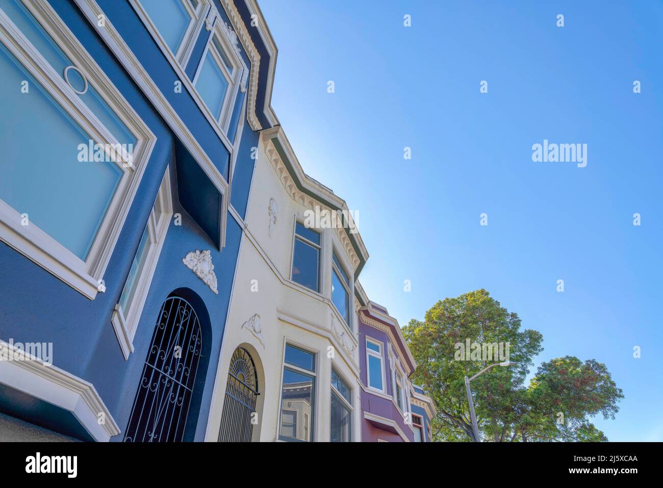 Low angle view of complex houses with arched iron door gate in San ...