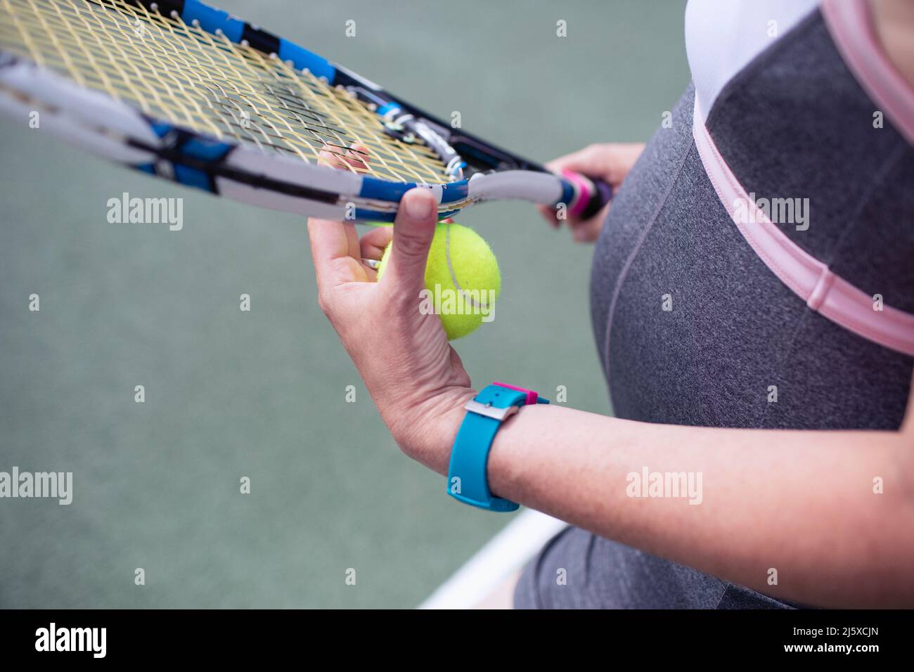 Close up pregnant woman with tennis racket and ball Stock Photo - Alamy