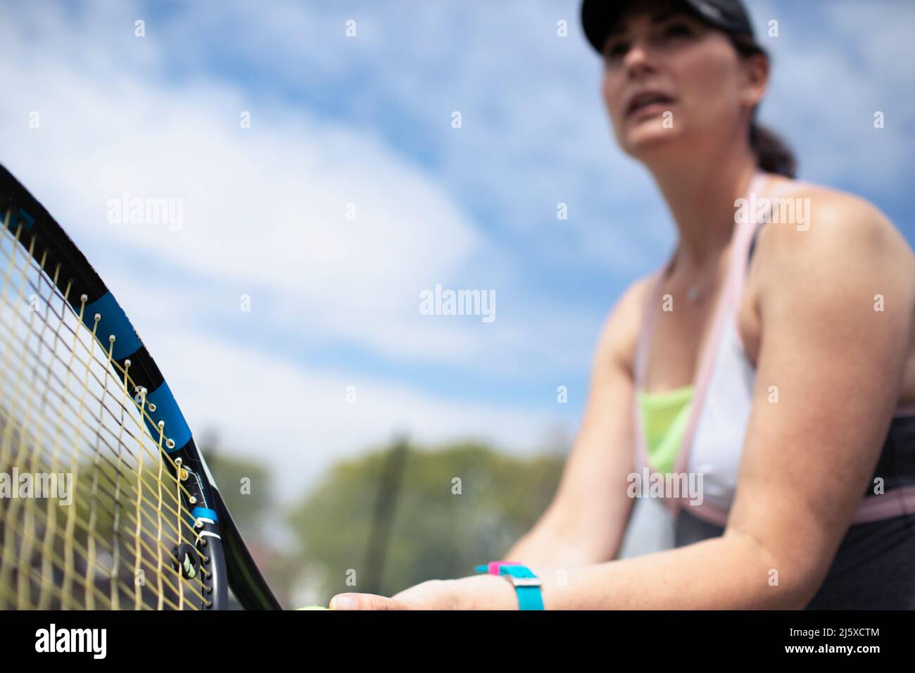 Woman standing tennis racket hi-res stock photography and images - Alamy