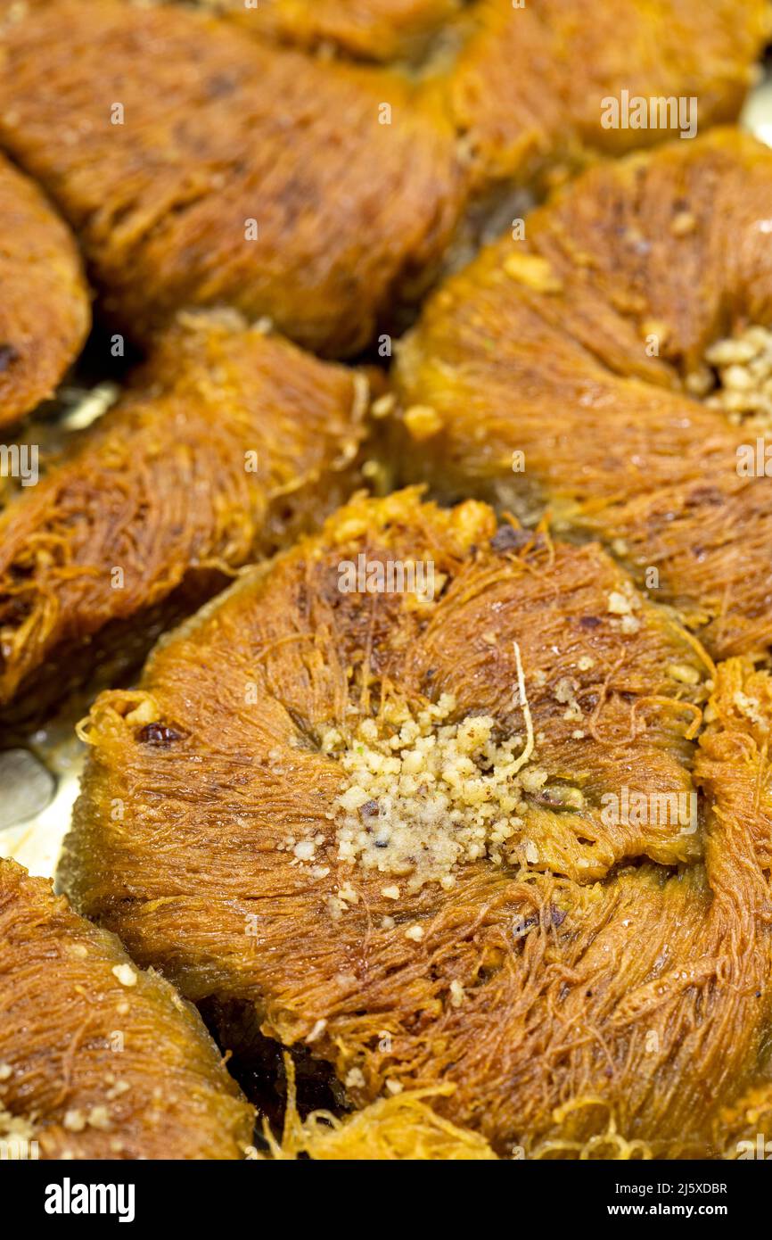Walnut kadayif. Kadayif dessert in a close-up tray. local name cevizli ...