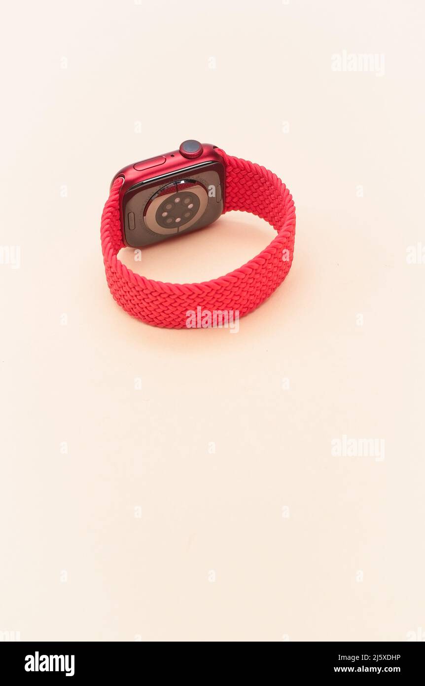 Apple watch Series 7 Product red smartwatch on a beige background ...