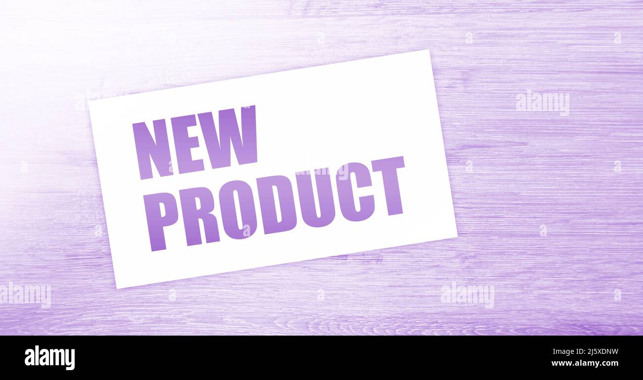 New Product words on card on wooden table. Business concept Stock Photo ...