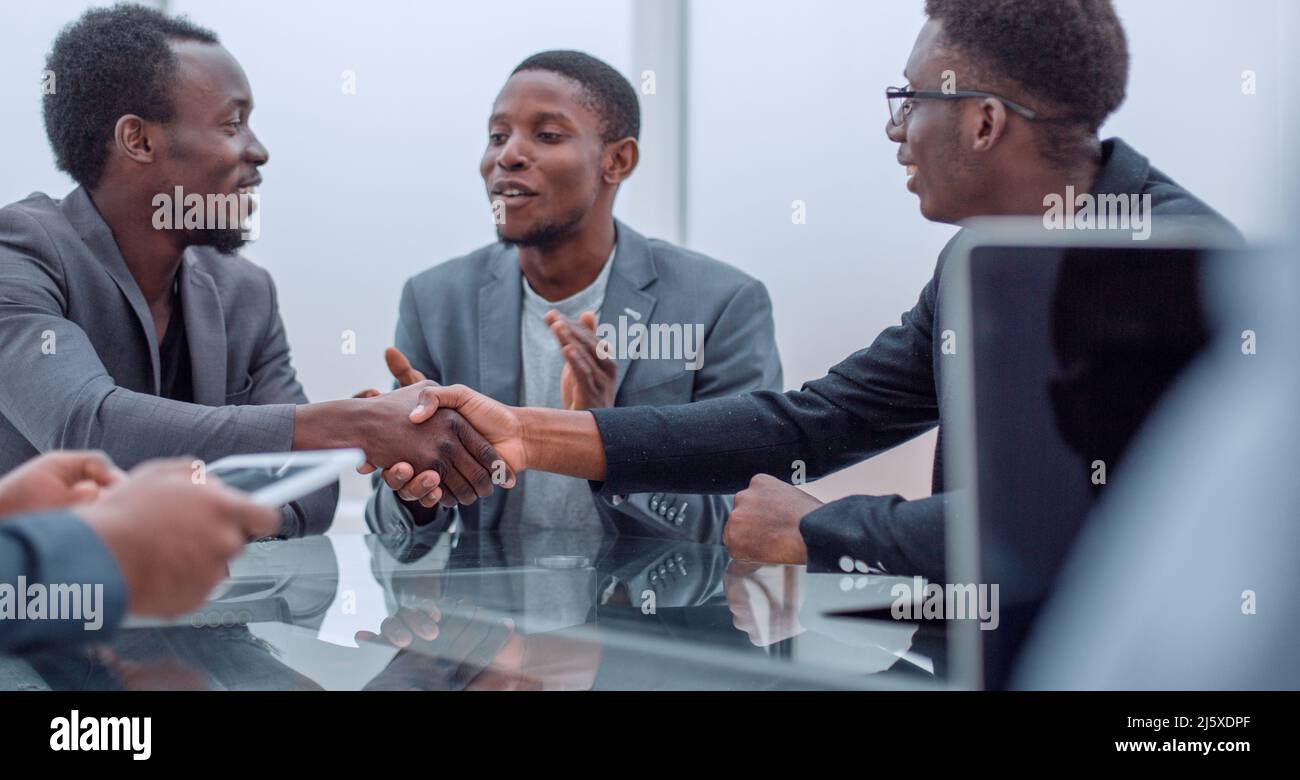 business partners greeting each other with a handshake Stock Photo - Alamy