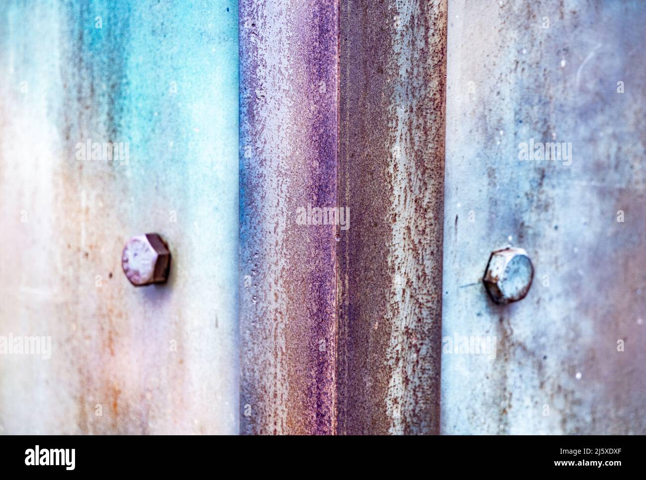 Background with metallic multicolored old coating with patches and ...