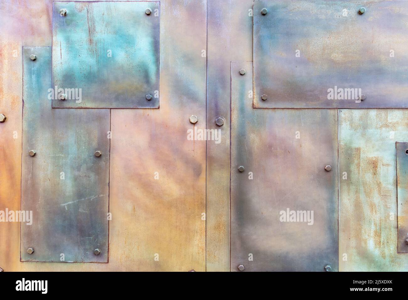 Background with metallic multicolored old coating with patches and ...