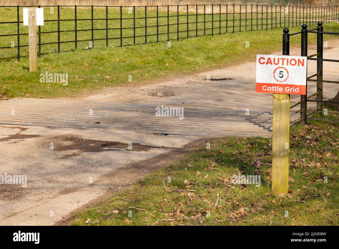 cattle grid and cattle grid warning sign Stock Photo - Alamy