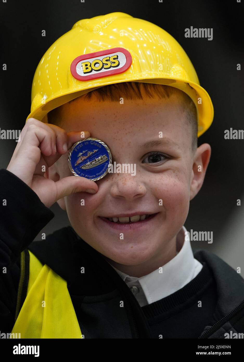 Josh Duffy(7) holds the coin he designed which was used during the Keel ...