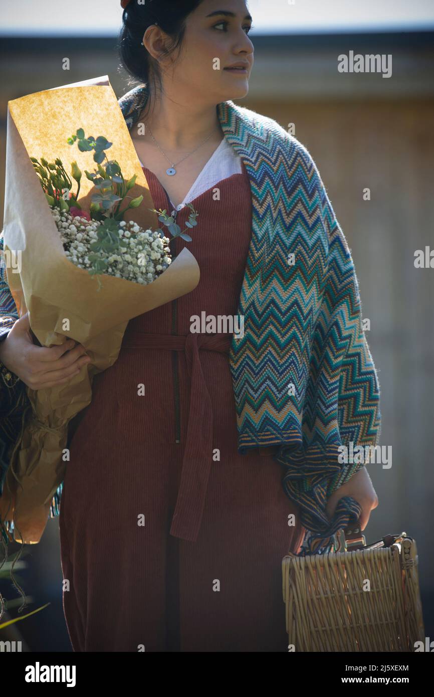 Woman carrying bouquet hi-res stock photography and images - Alamy