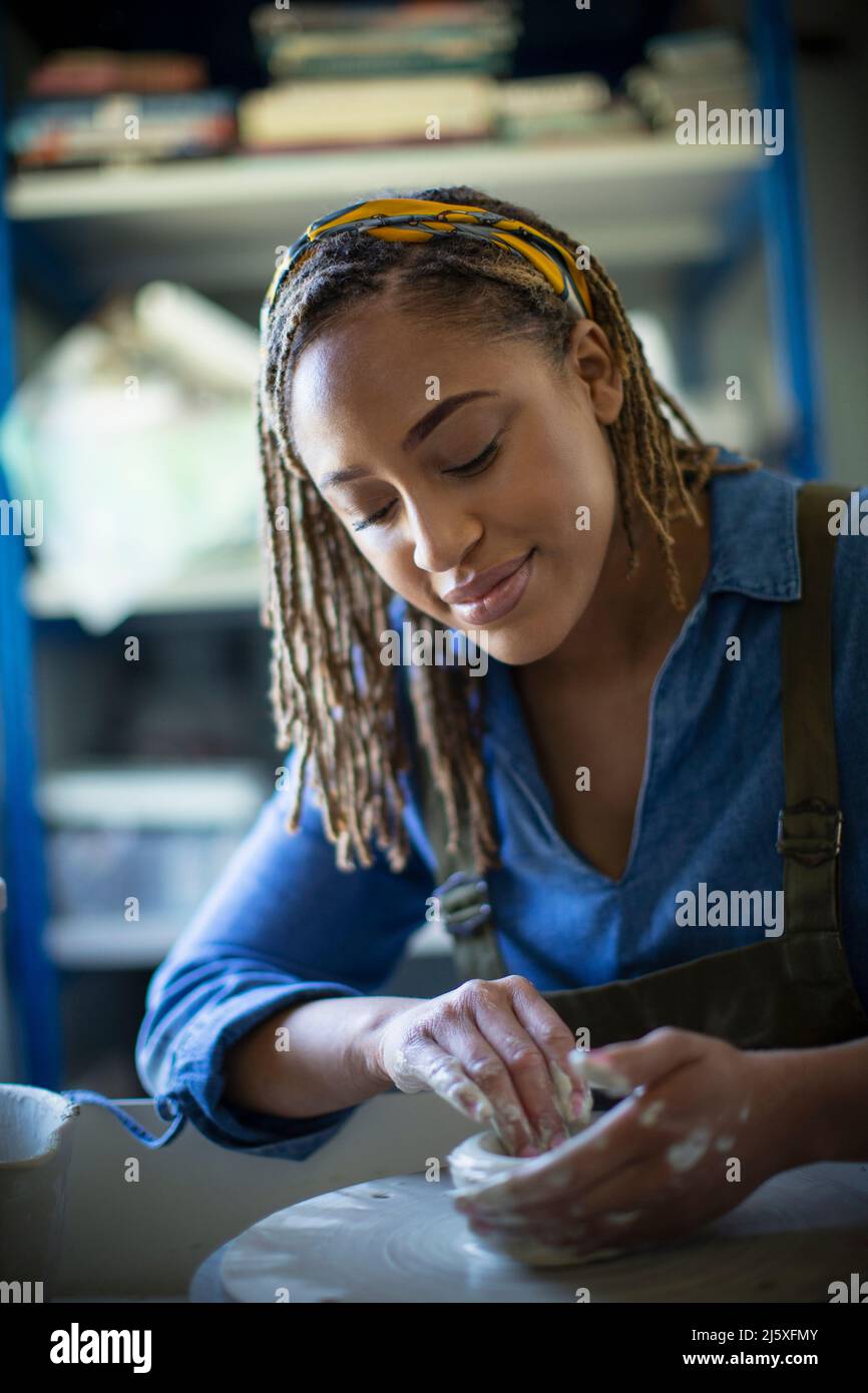 Young woman at pottery wheel Stock Photo - Alamy
