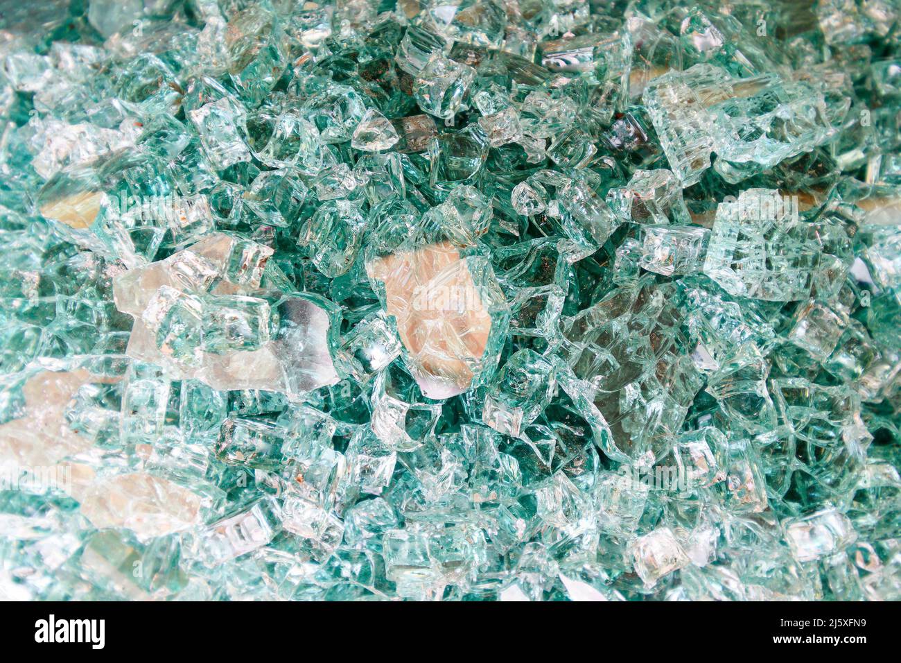 Surface full of broken tempered glass shards, broken green tempered ...