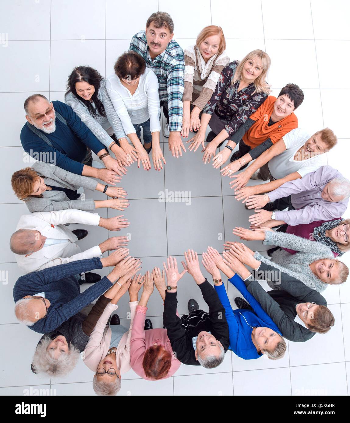 group of mature people showing their unity Stock Photo - Alamy