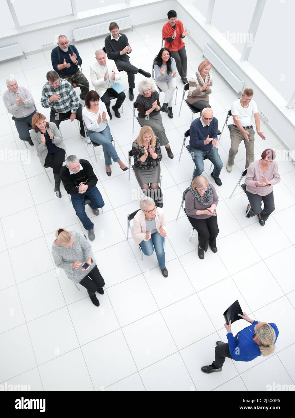 speaker and a group of senior people starting a seminar Stock Photo - Alamy